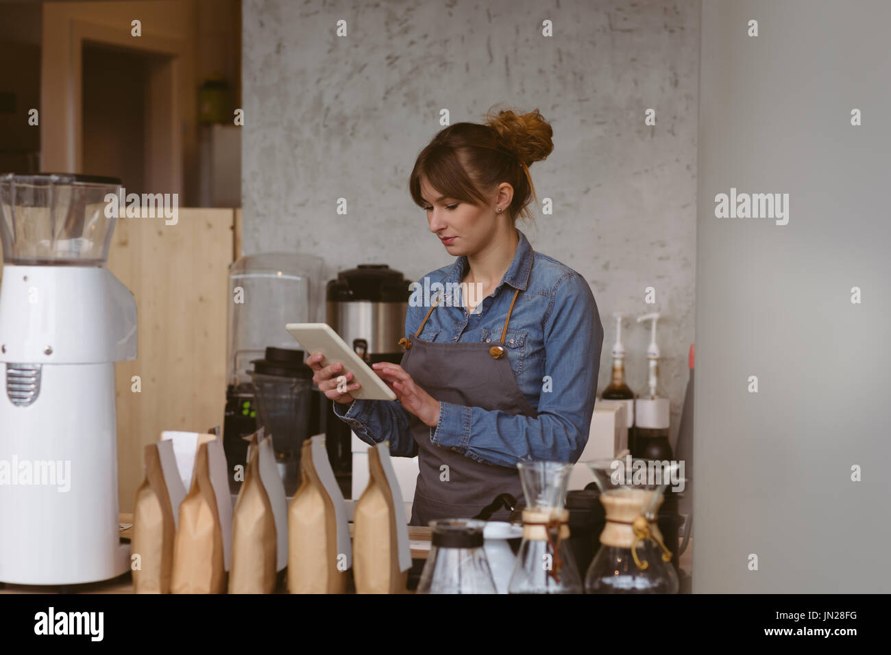 Waitress using touchscreen in restaurant hi-res stock photography and ...
