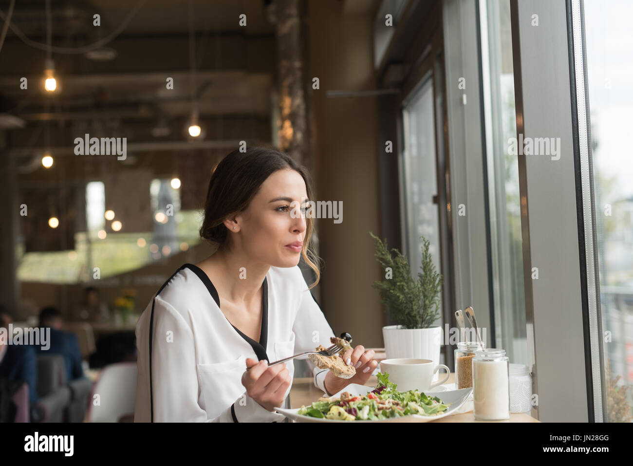 Woman eating ready meal hi-res stock photography and images - Alamy