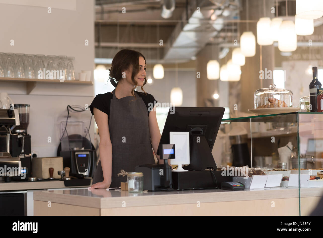Standing at counter in cafe hi-res stock photography and images - Alamy