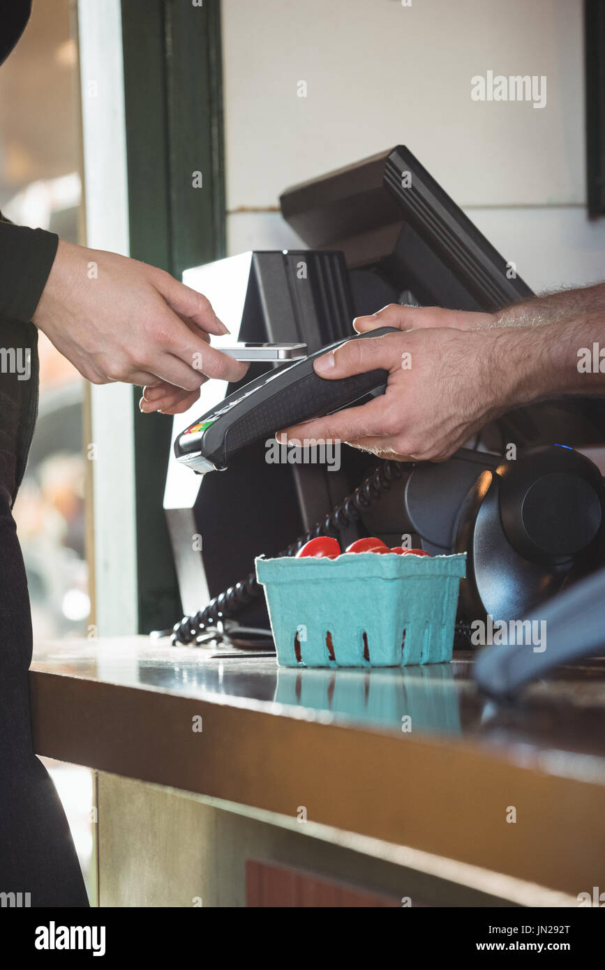 Woman using smartphone pay hi-res stock photography and images - Alamy
