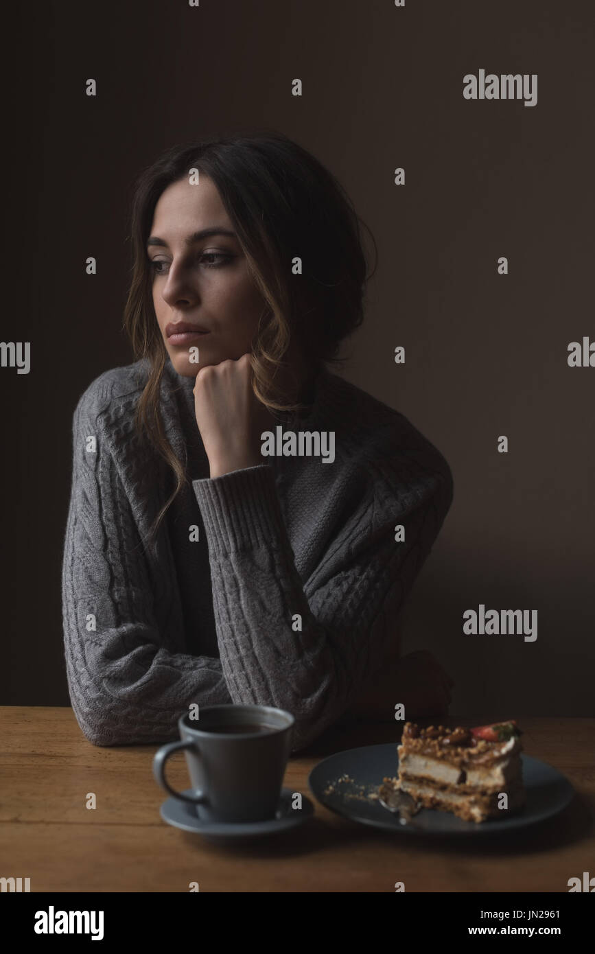 Woman table chin on hand hi-res stock photography and images - Alamy