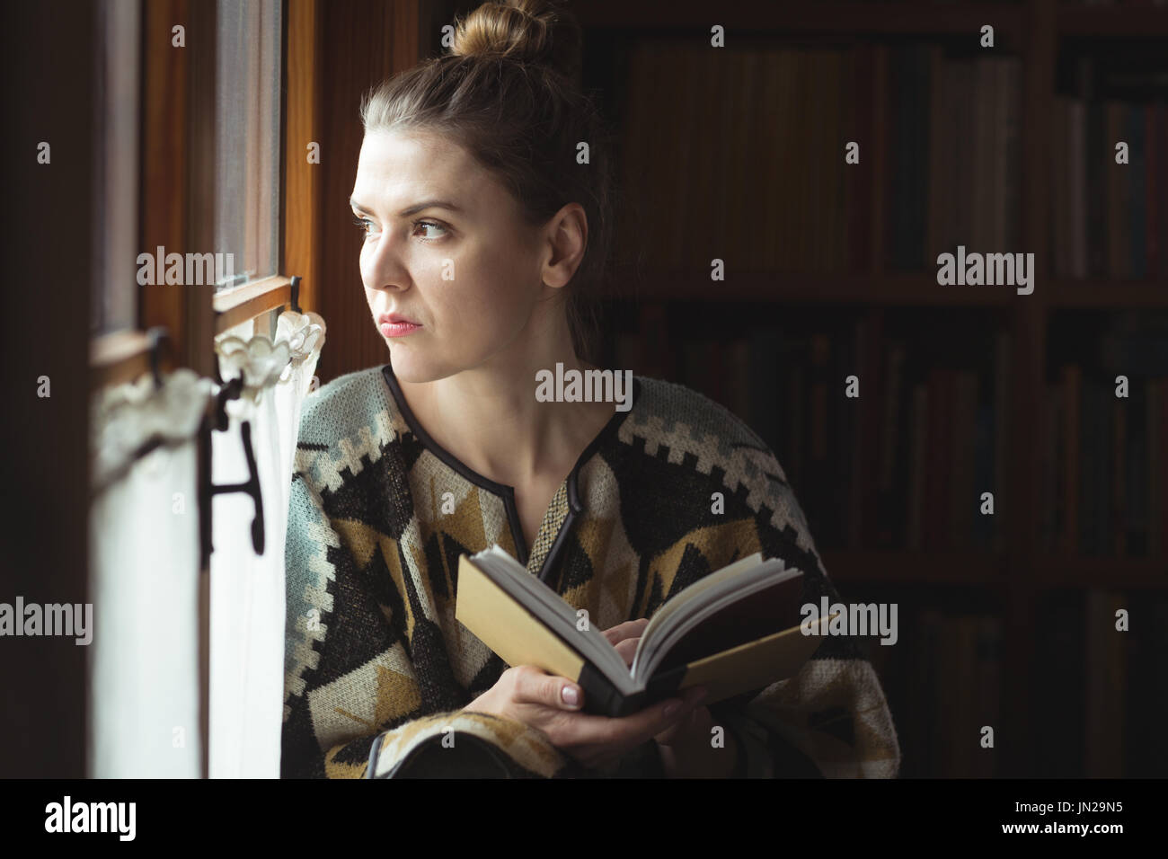 Looking through book hi-res stock photography and images - Alamy