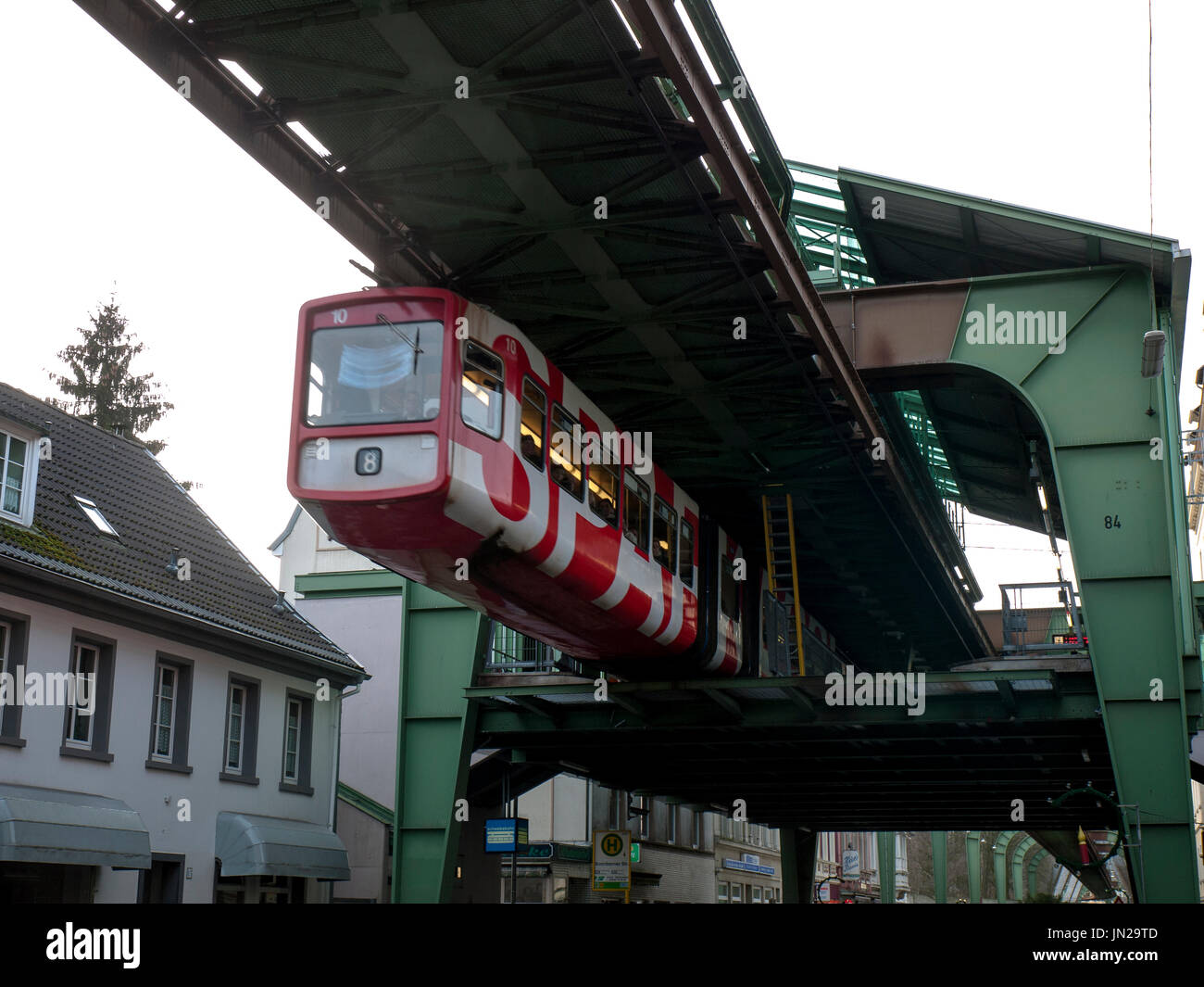 Monorail "Die Schwebebahn" pulling into a station in Wuppertal, Germany ...
