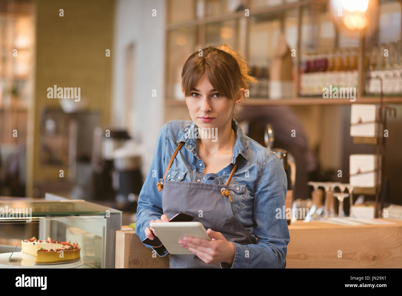 Attractive young waitress using hi-res stock photography and images - Alamy