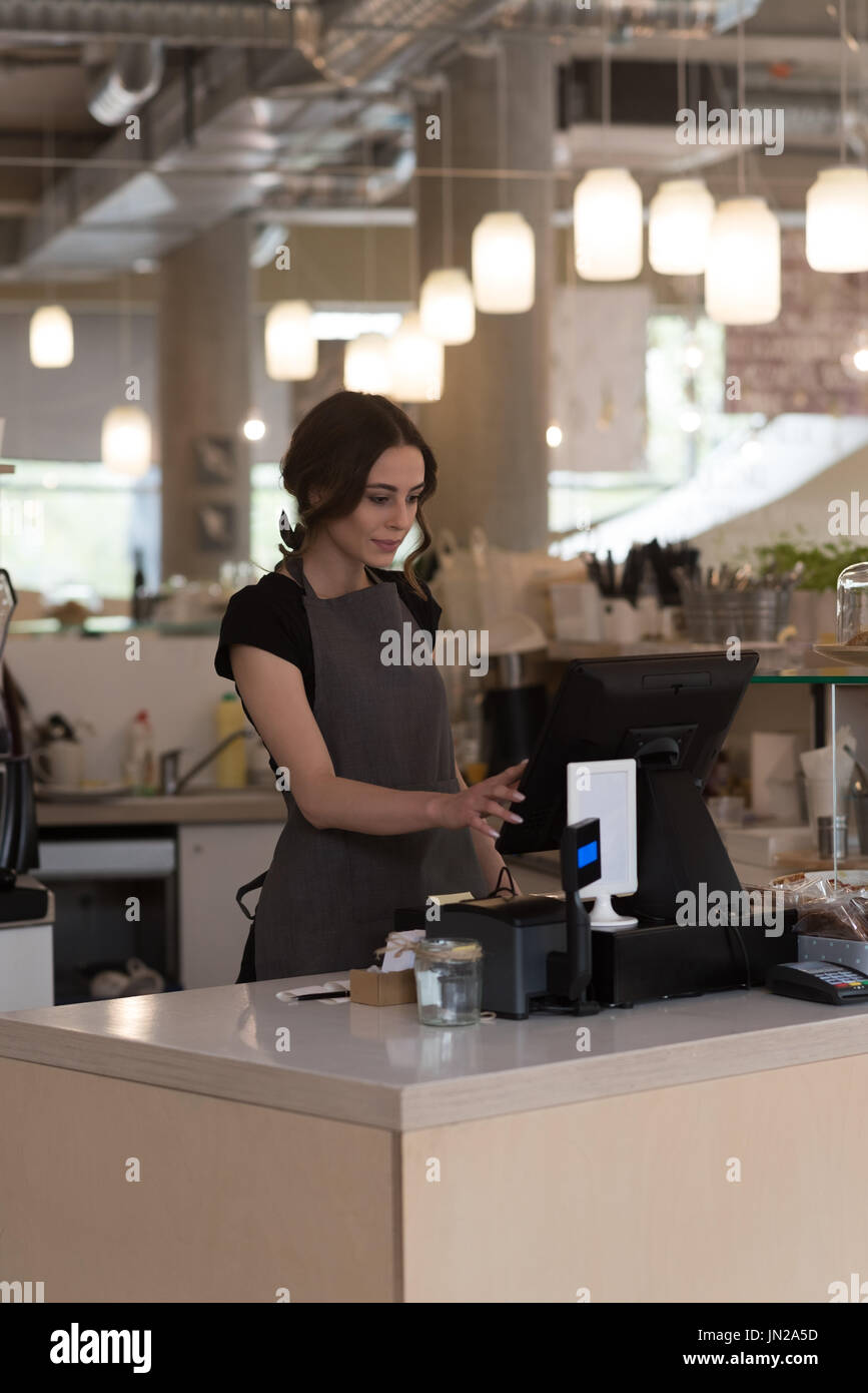 Female cash counter hi-res stock photography and images - Alamy
