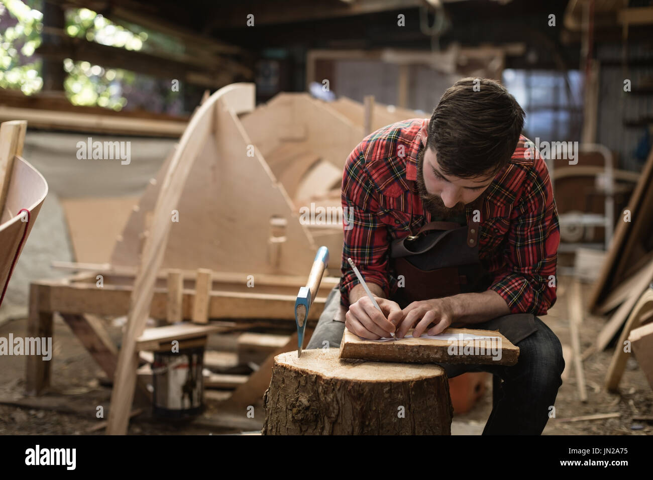 Focused carpenter shaping wood in hi-res stock photography and images ...