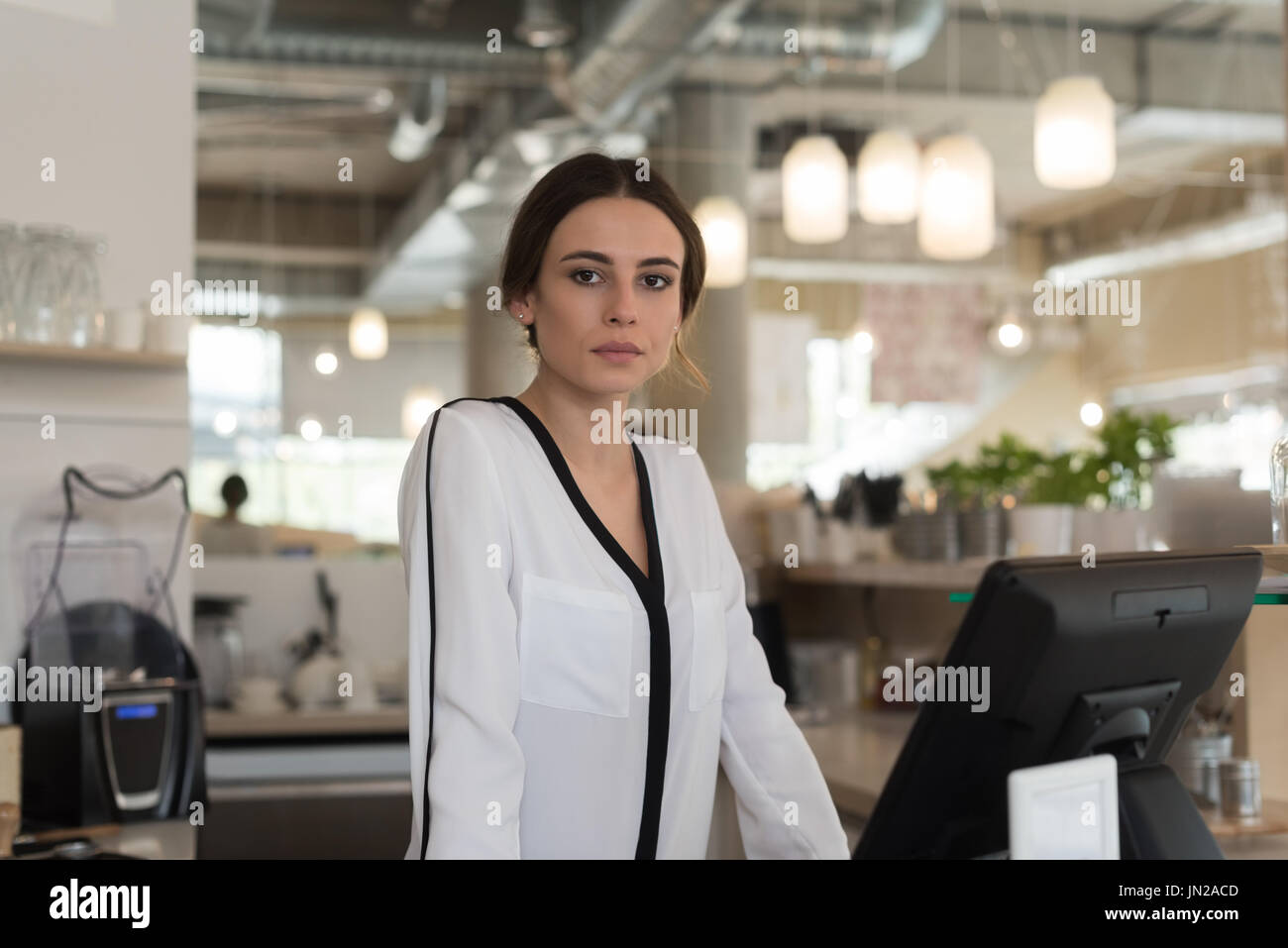 Female checkout counter hi-res stock photography and images - Alamy