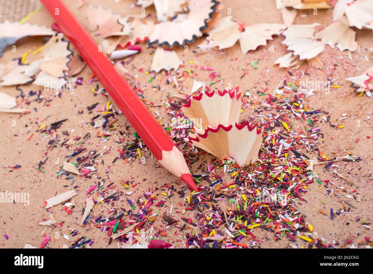 Red Color Pencil over some pencil shavings Stock Photo - Alamy