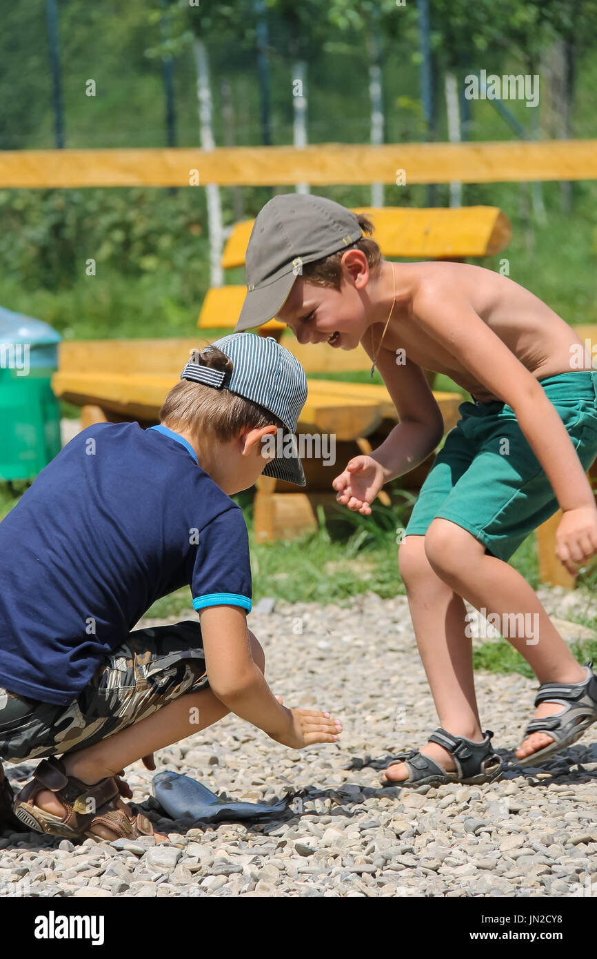 Two boys with freshly caught fish in summer Stock Photo - Alamy