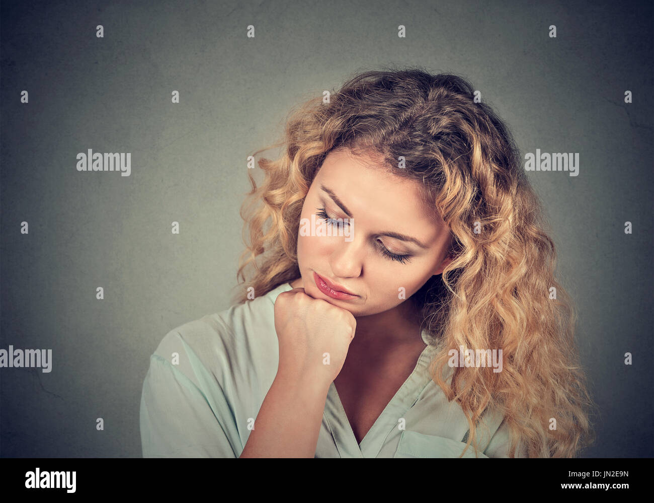 portrait of a sad woman looking down Stock Photo - Alamy