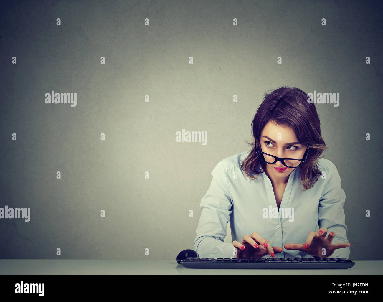 Nerd typing on keyboard hi-res stock photography and images - Alamy