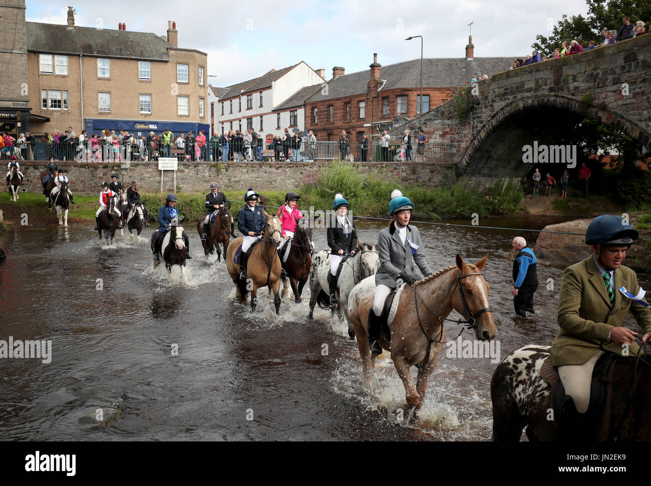 Horse and riders take part in the Riding of the Marches ford on the ...