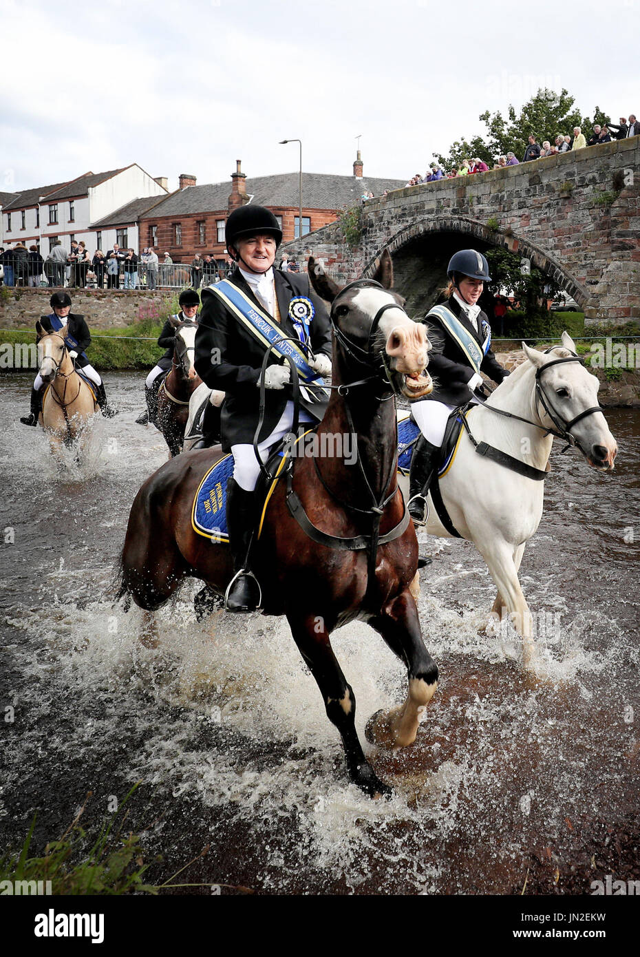 Horse and riders take part in the Riding of the Marches ford on the ...