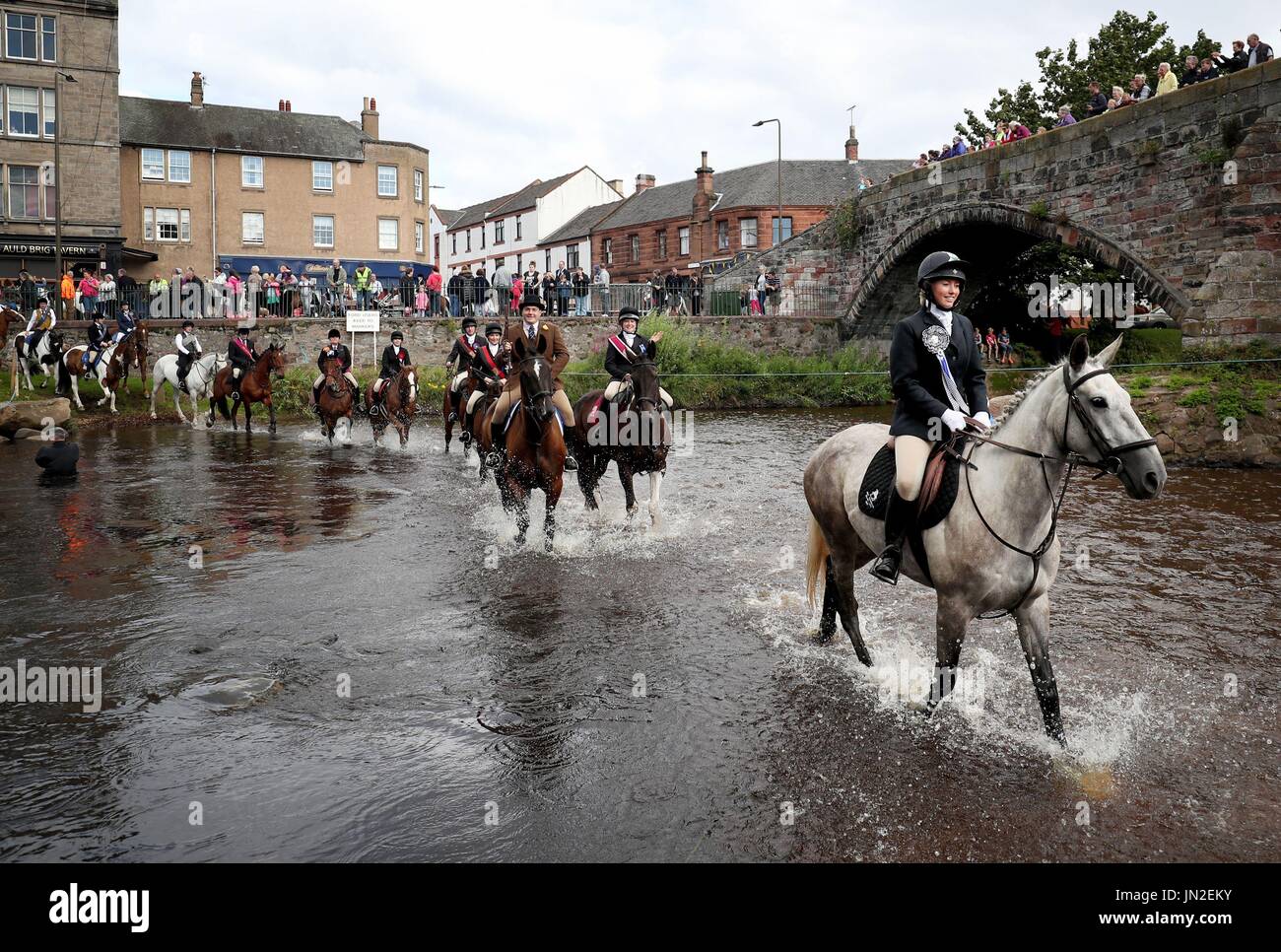 Horse and riders take part in the Riding of the Marches ford on the ...