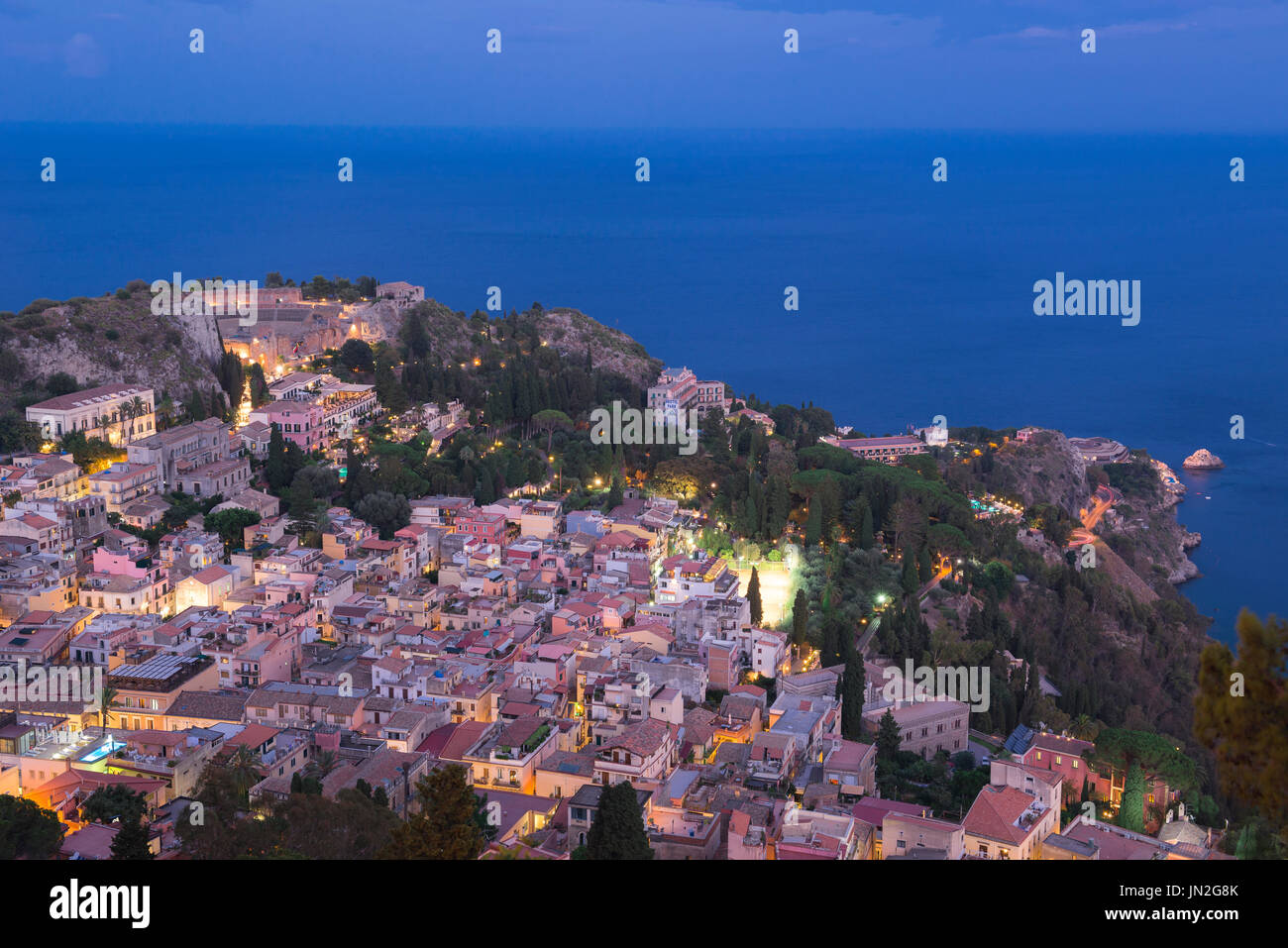 Taormina Sicily, aerial view at dusk of the historic town of Taormina ...