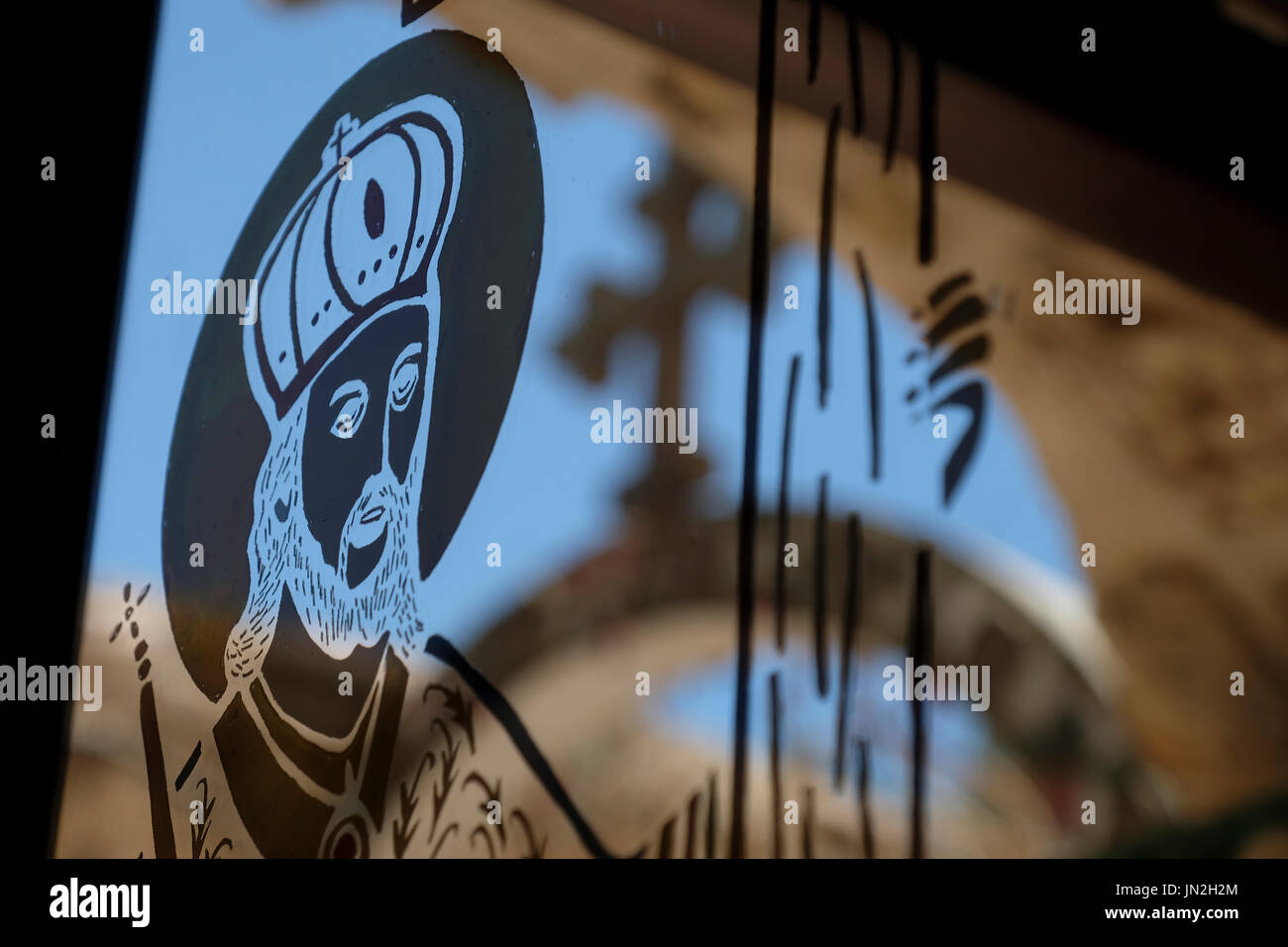 The 9th station of the cross is reflected in a mirror bearing the image ...