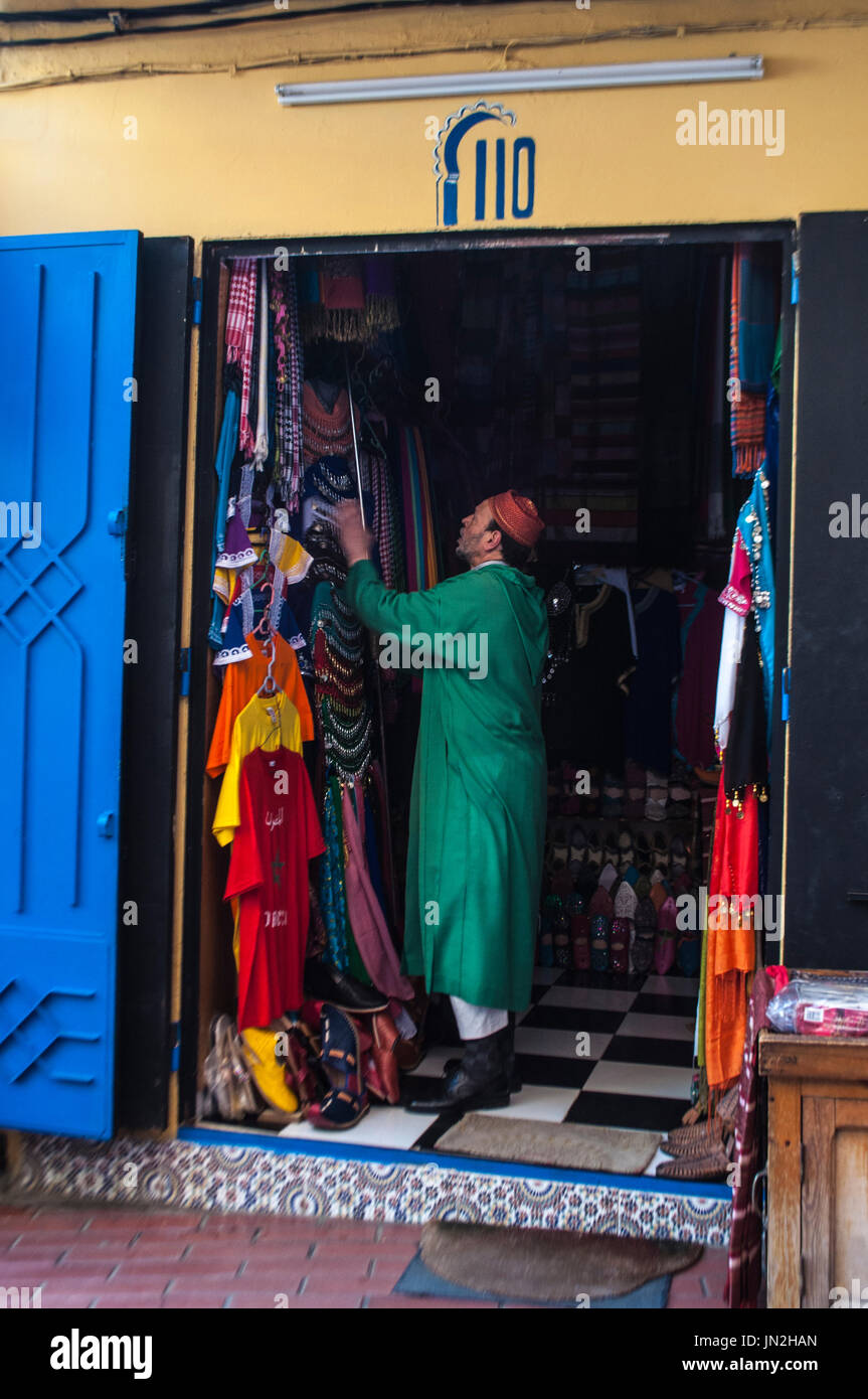Morocco: a moroccan vendor in the souk, the market in the medina of ...