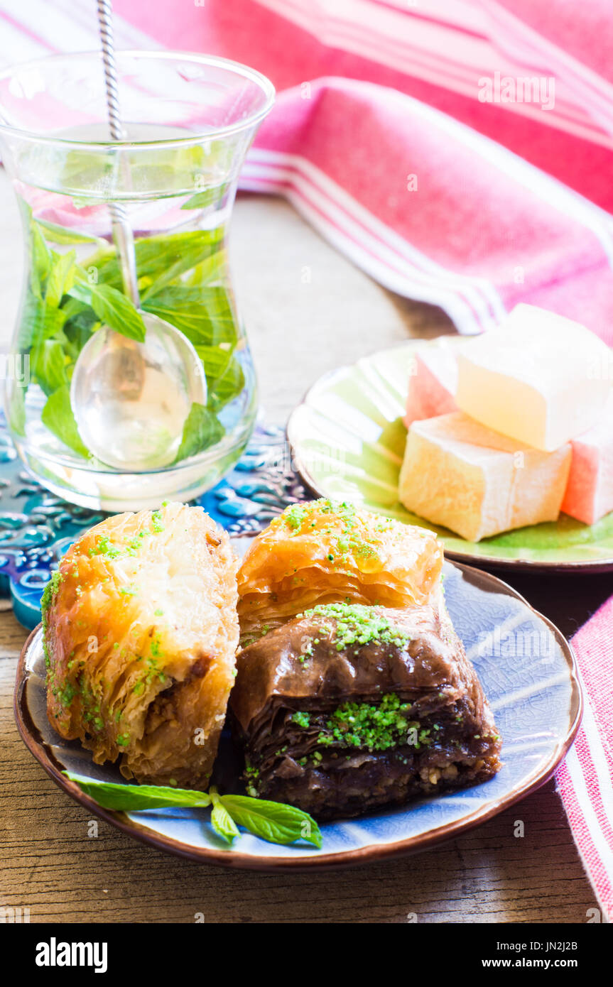 Traditional turkish dessert - mint tea and bakhlava on rustic ...