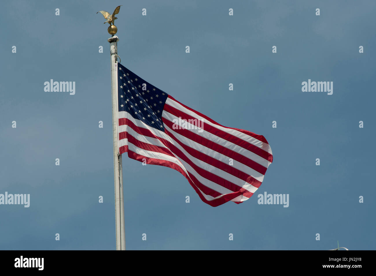 The American Flag on a flagpole on top of the White House in Washington ...