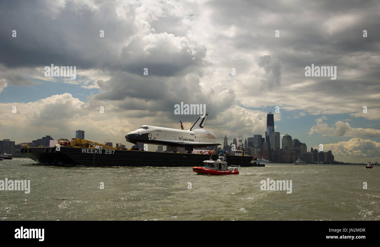 The space shuttle Enterprise is towed by barge up the Hudson River in ...