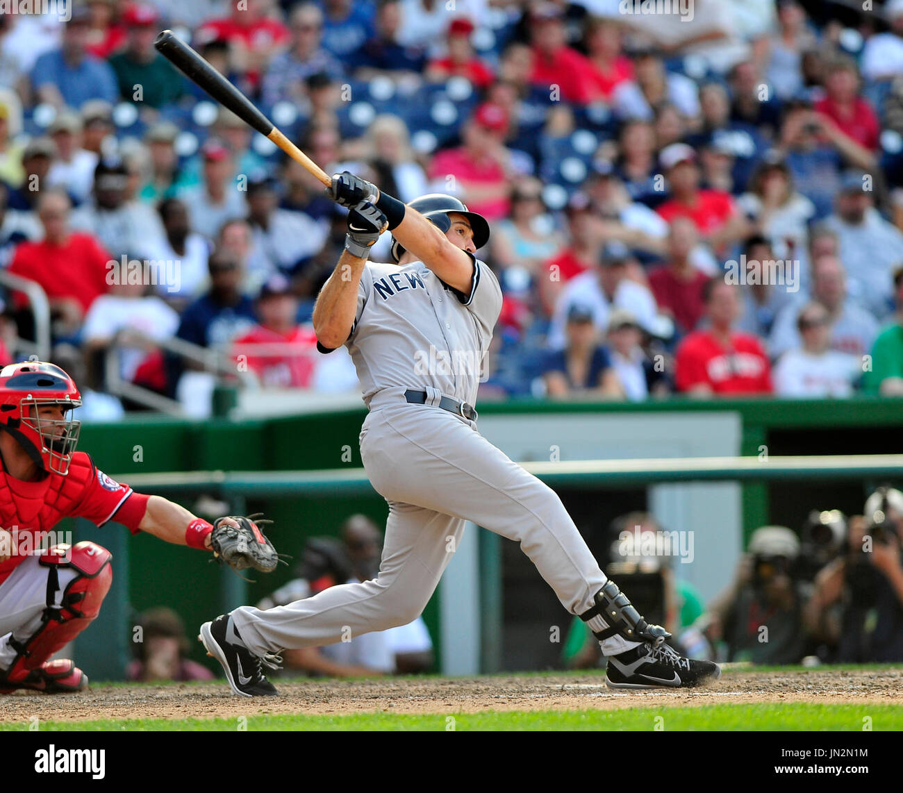 New York Yankees first baseman Mark Teixeira (25) doubles in the 14th ...