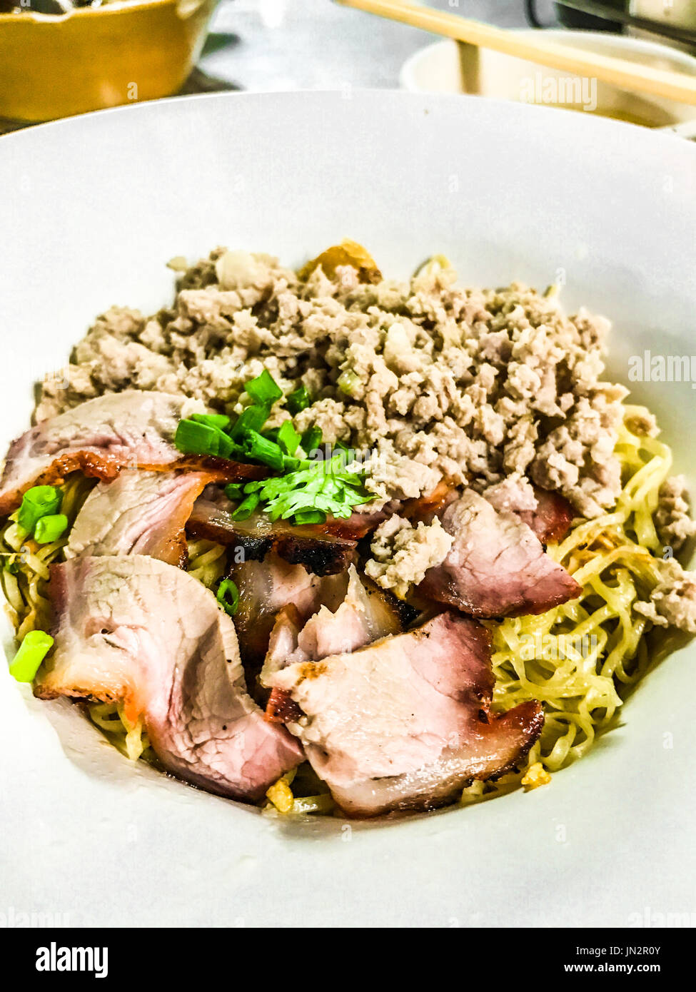 Asian Street Food. Closeup Egg noodle with red honey roasted pork (char ...