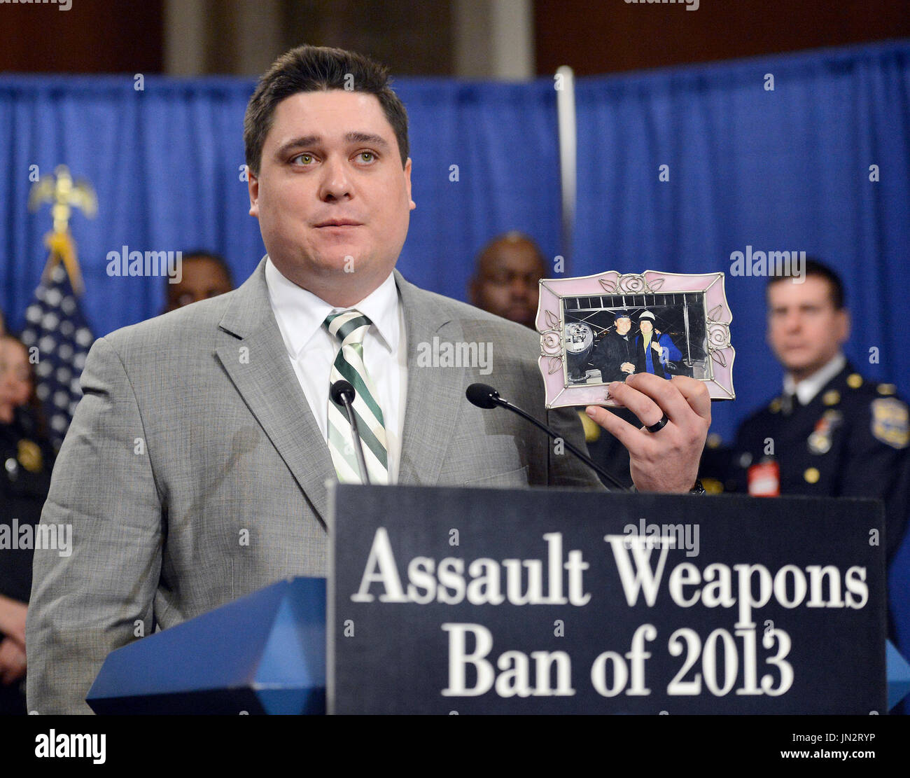 Christian Heyne, shows a photo of his parents who were shot on Memorial ...