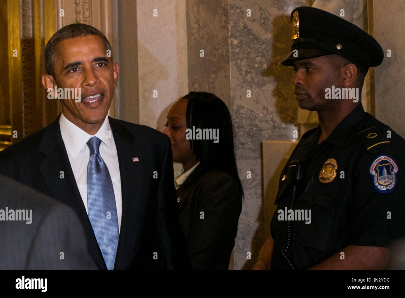 United States President Barack Obama walks past waiting media on his ...