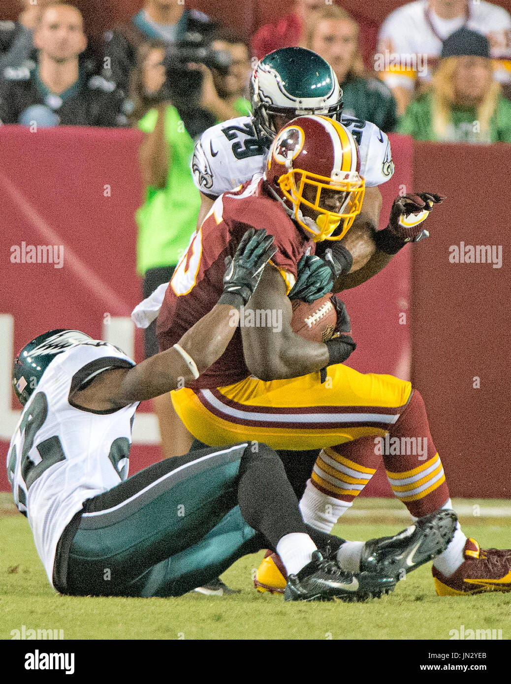Washington Redskins wide receiver Joshua Morgan (15) fights for yardage ...