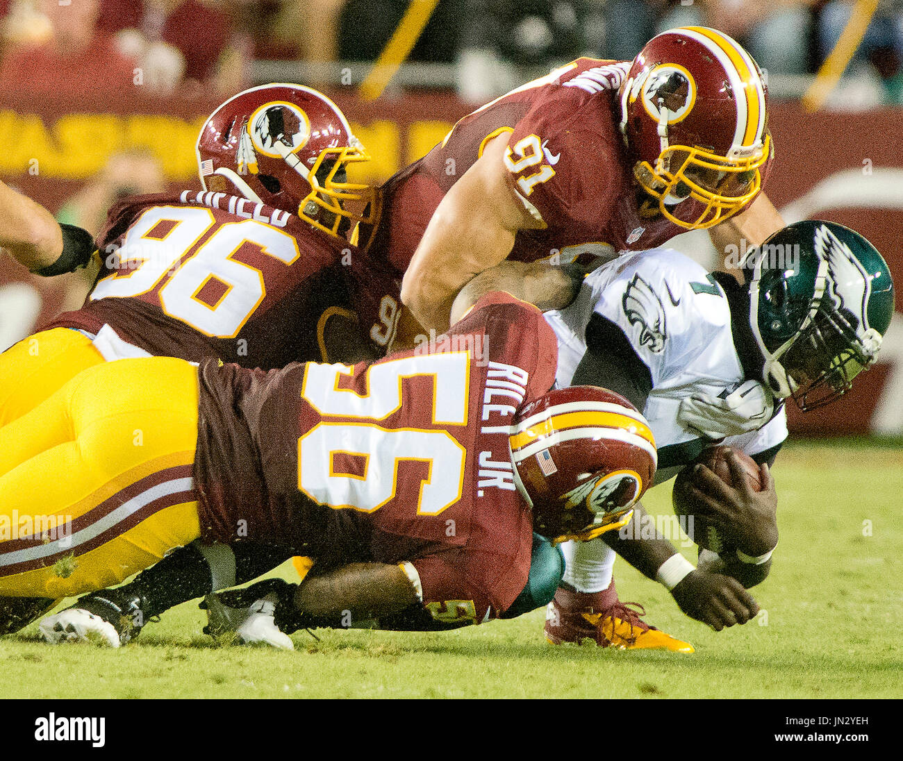 Philadelphia Eagles quarterback Michael Vick (7) is sacked by ...