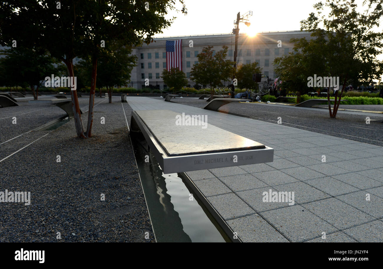 The sun rises over the Pentagon and the Pentagon Memorial on September ...