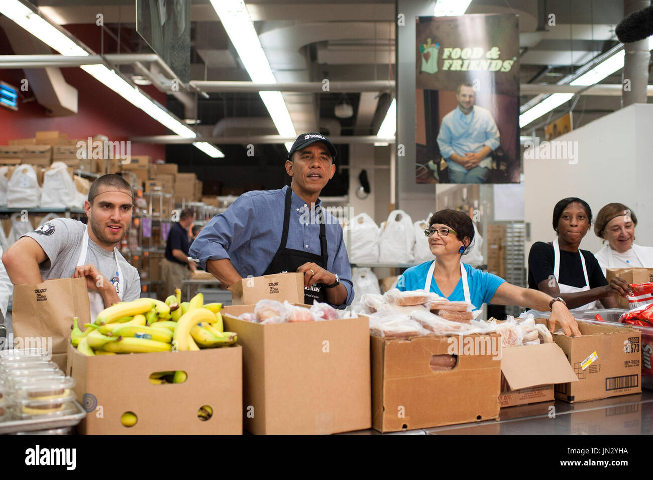 United States President Barack Obama helps pack food donation bags at ...
