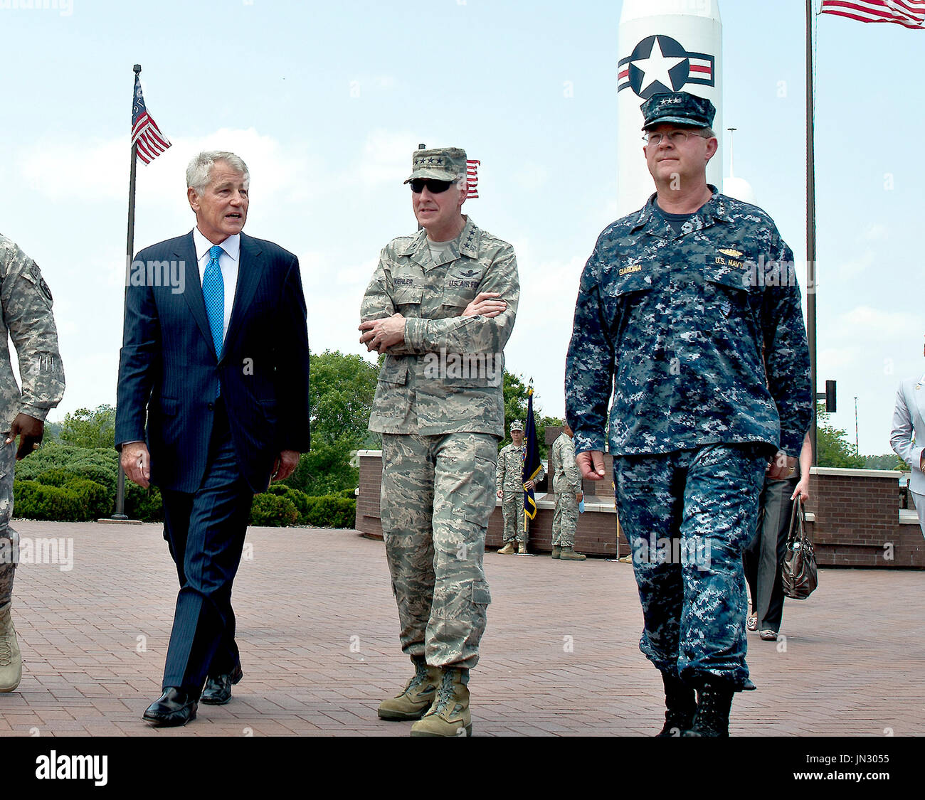 Secretary of Defense Chuck Hagel, left, walks with Strategic Command ...