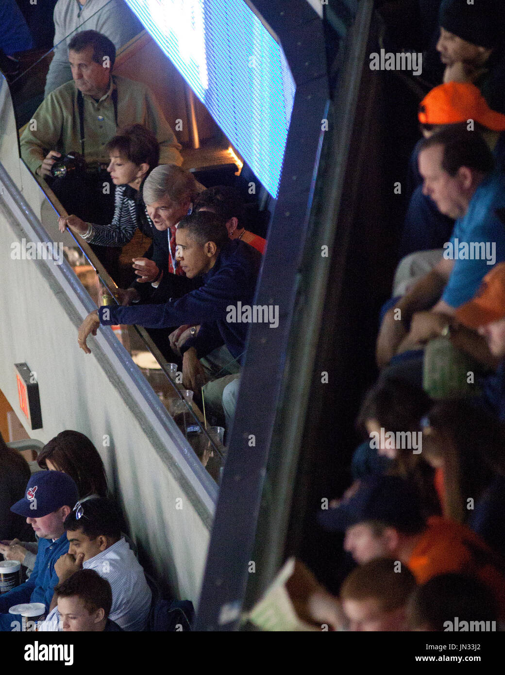 United States President Barack Obama (with arm over rail) watches the ...