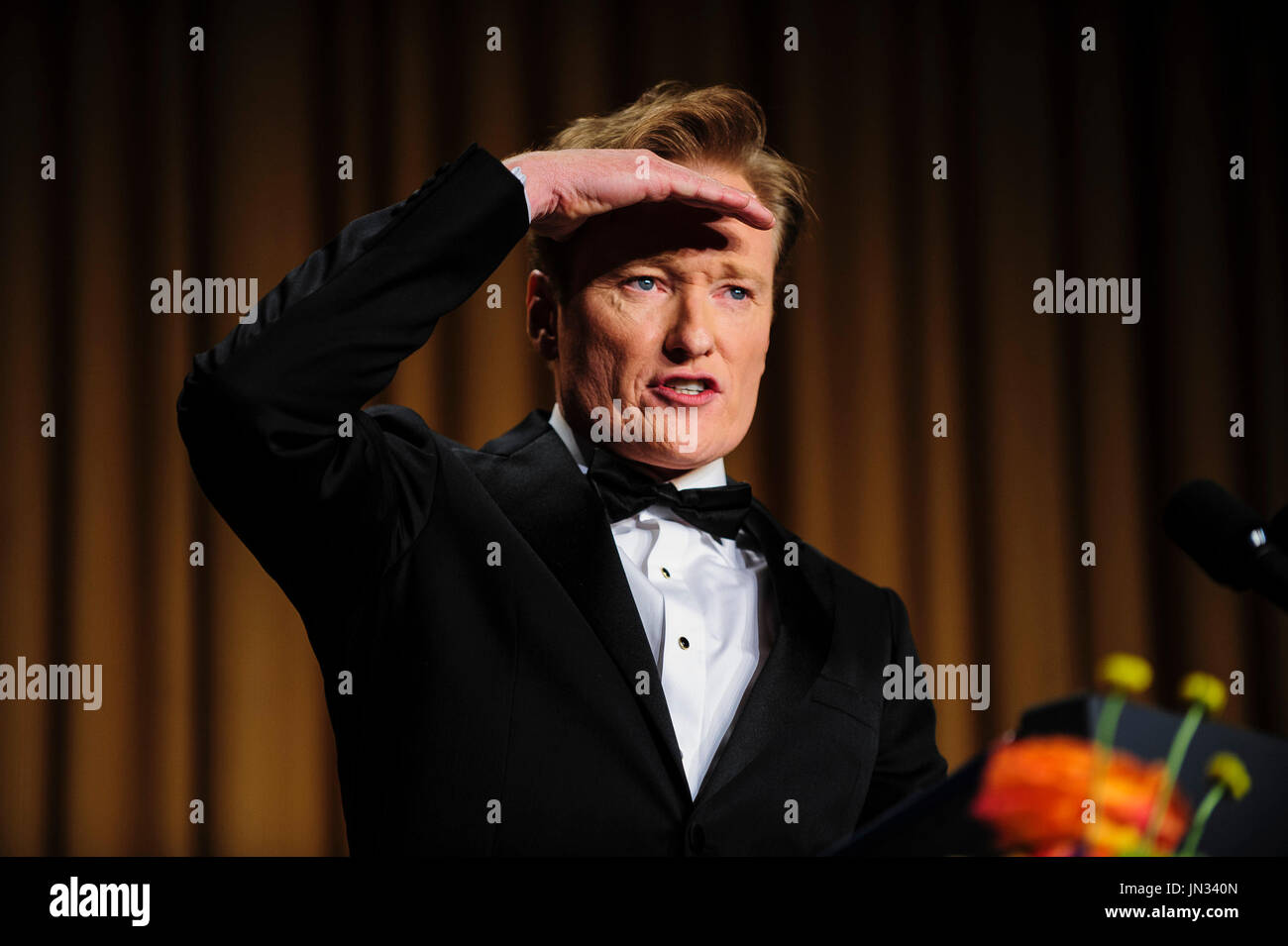 Comedian Conan O'Brien delivers a comedy routine during the White House ...