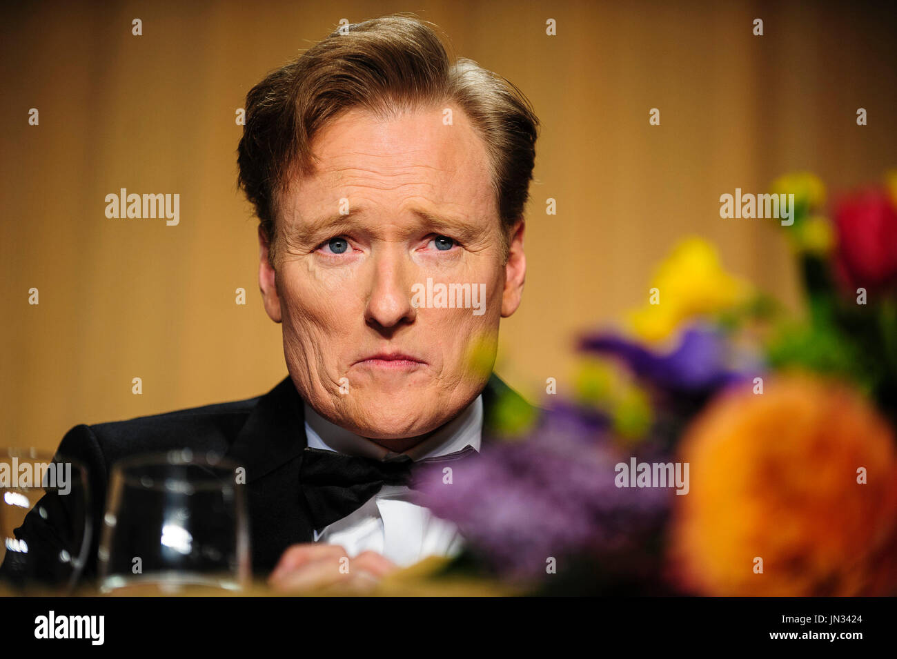 Comedian Conan O'Brien looks into the audience at the White House ...