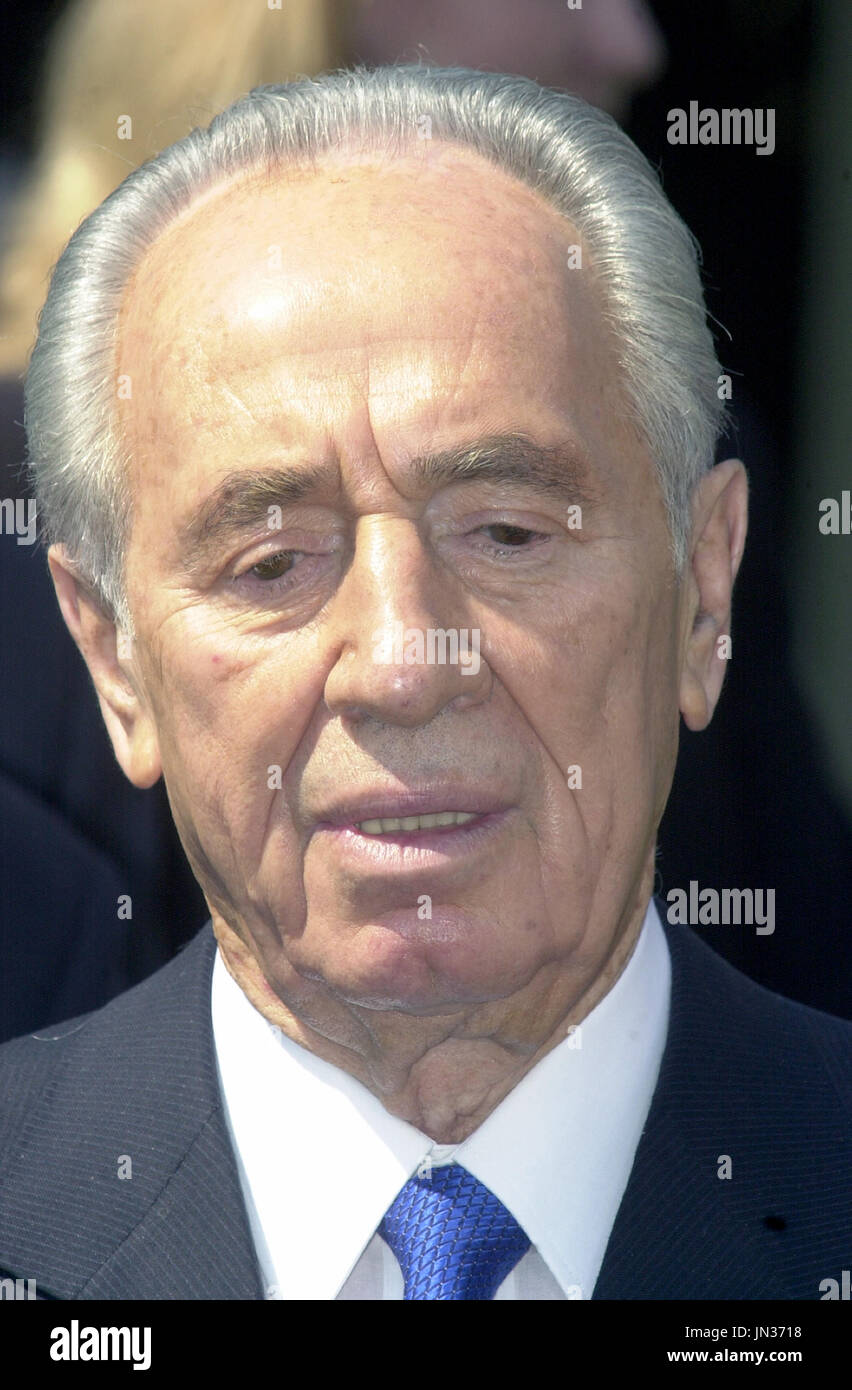 Foreign Minister Shimon Peres of Israel meets reporters outside the ...