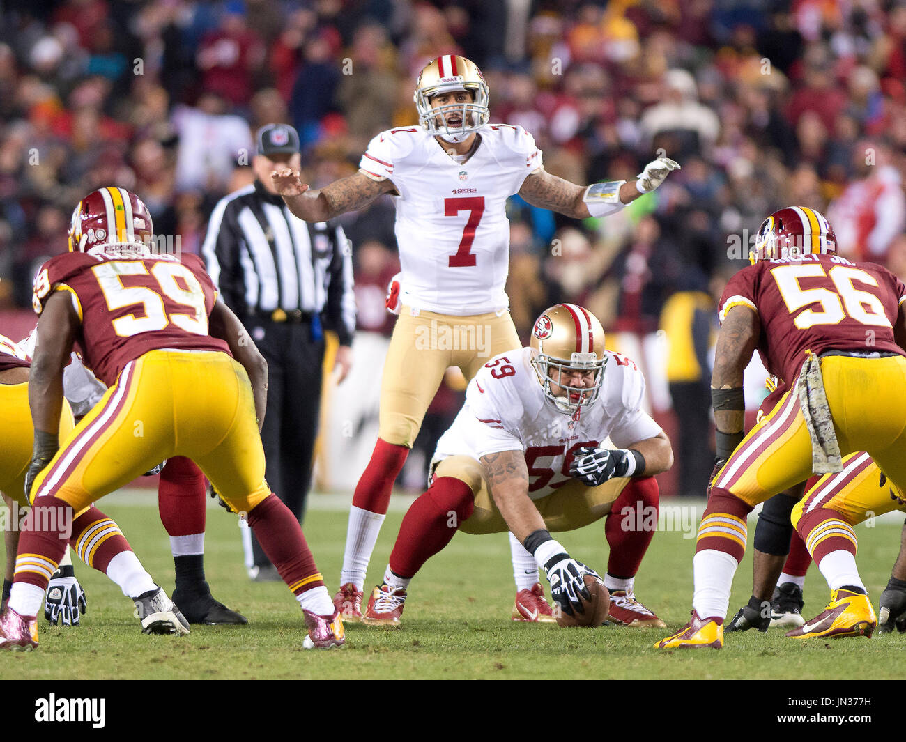 San Francisco 49ers quarterback Colin Kaepernick (7) directs his team's ...