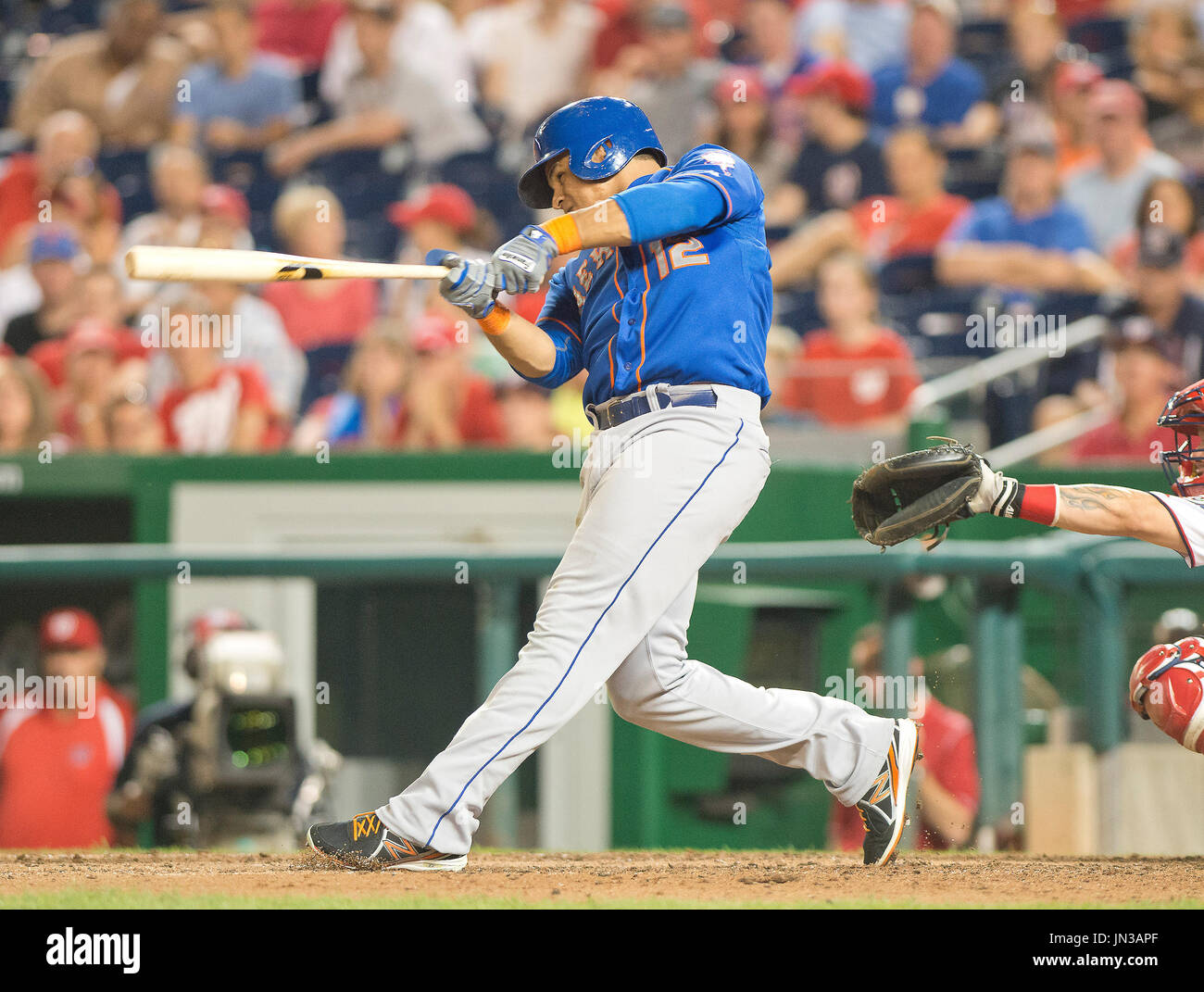 New York Mets center fielder Juan Lagares (12) lines into a double play ...
