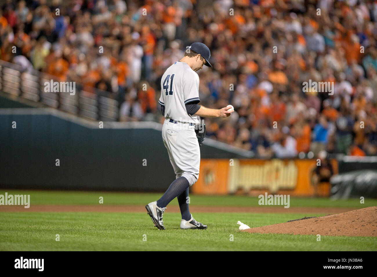 New York Yankees pitcher David Phelps (41) walks dejectedly back to the ...
