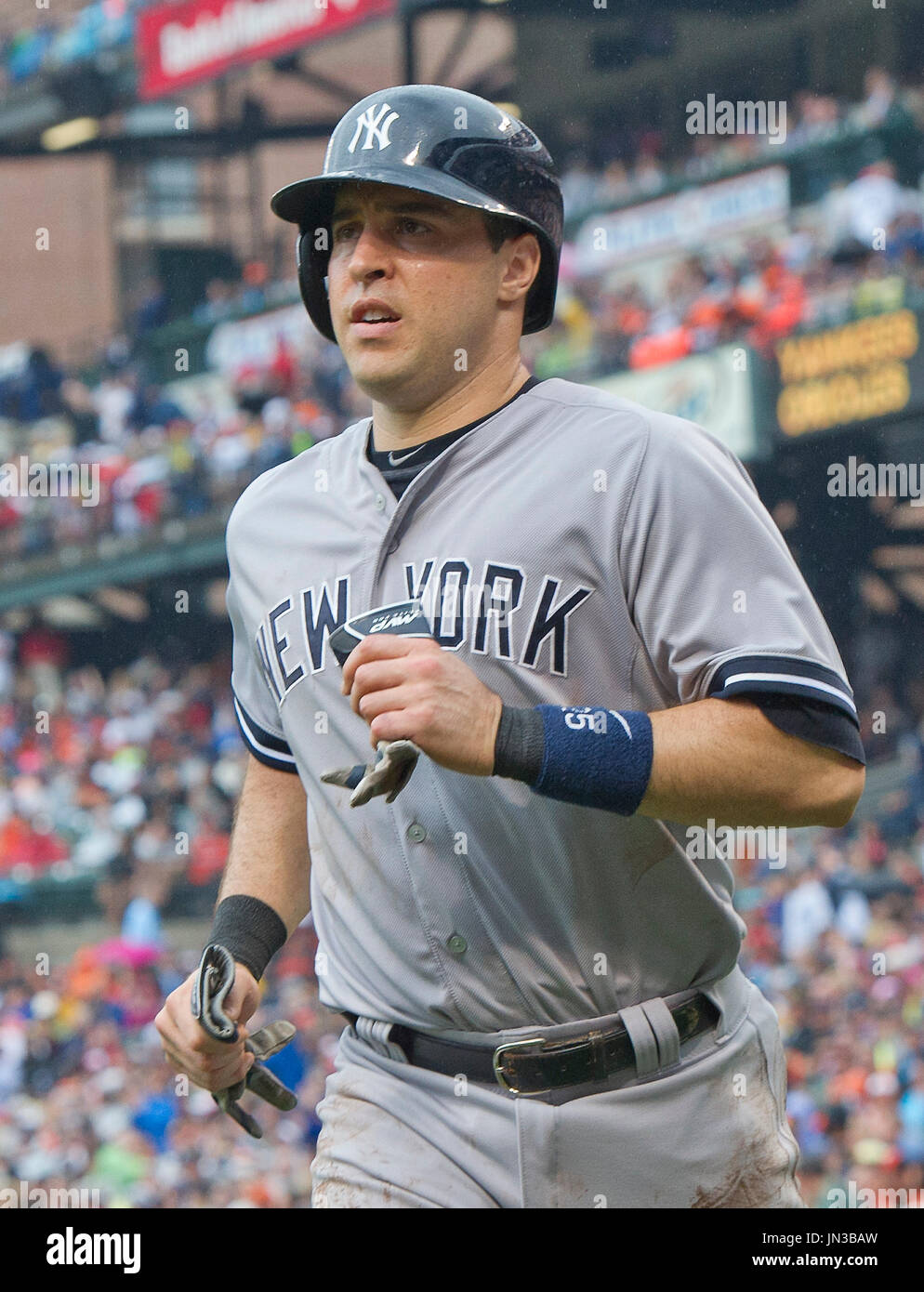 New York Yankees first baseman Mark Teixeira (25) slides into third ...