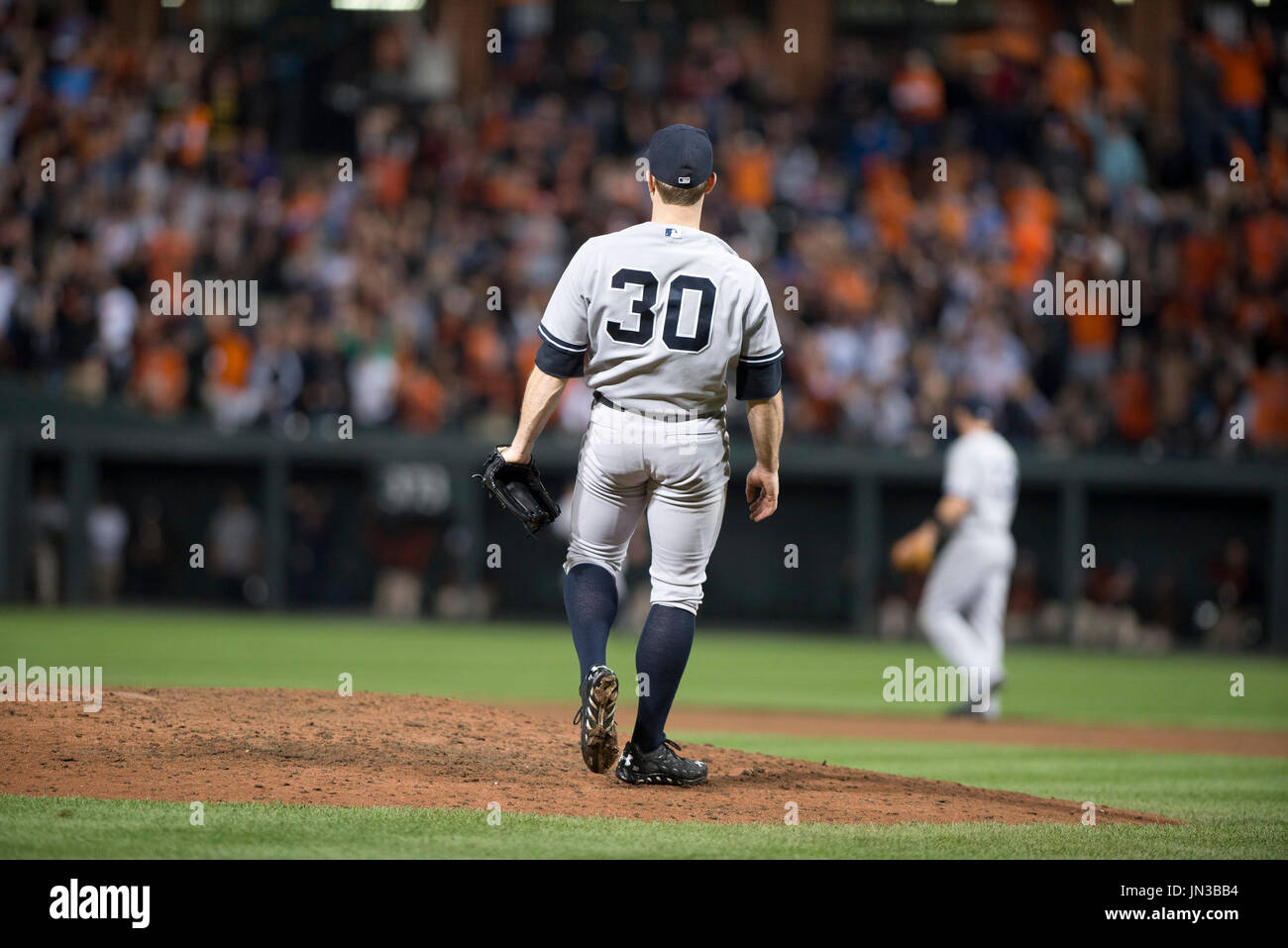 New York Yankees pitcher David Robertson (30) looks to the outfield ...