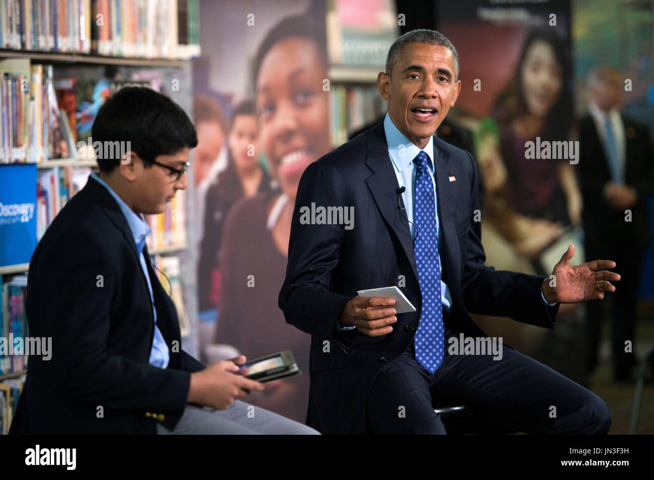 US President Barack Obama (R), with student moderator Osman Yaya (L ...