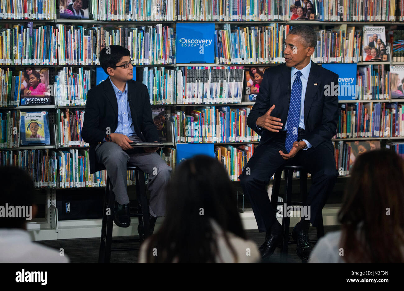 US President Barack Obama (R), with student moderator Osman Yaya (L ...
