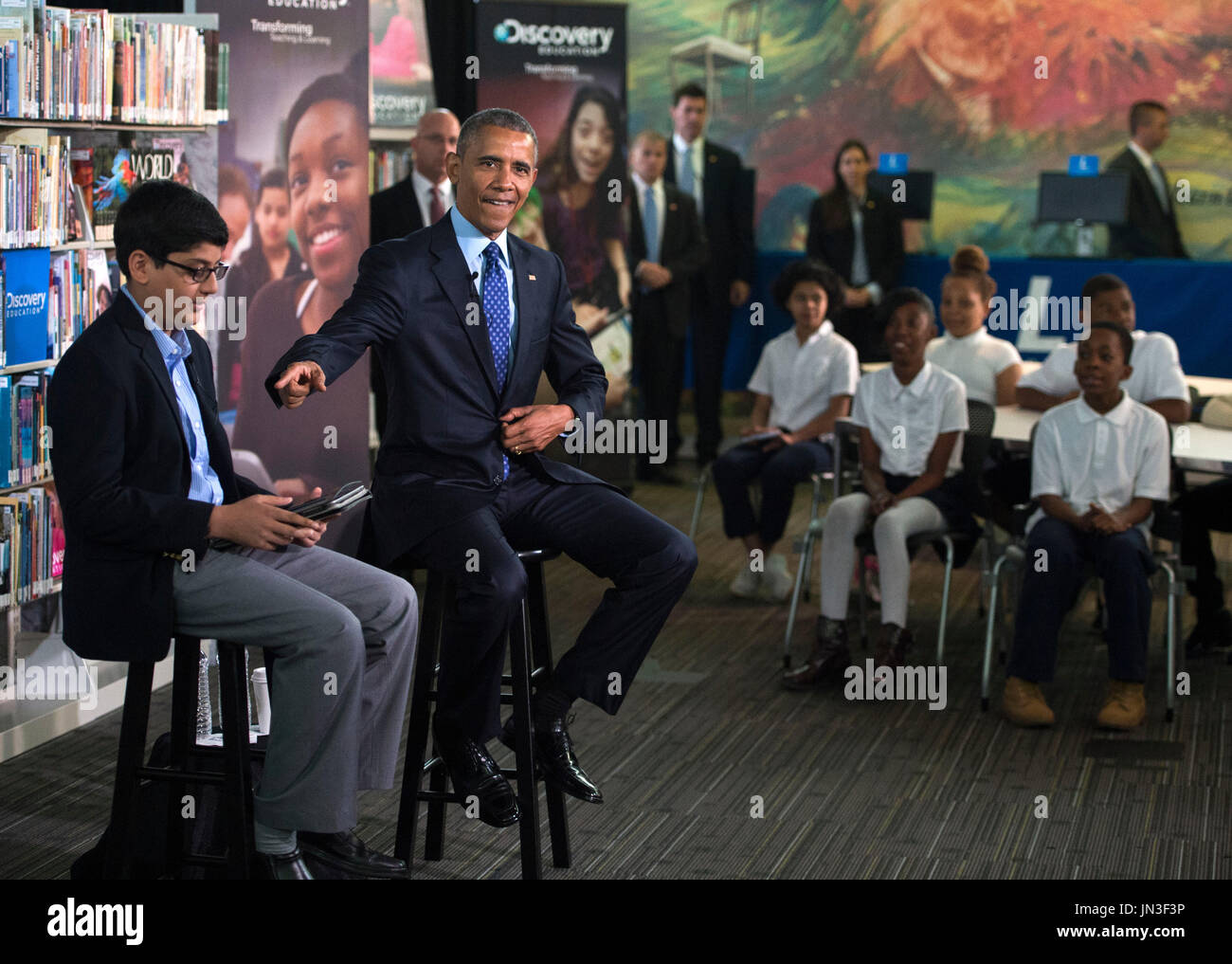 US President Barack Obama (R), with student moderator Osman Yaya (L ...