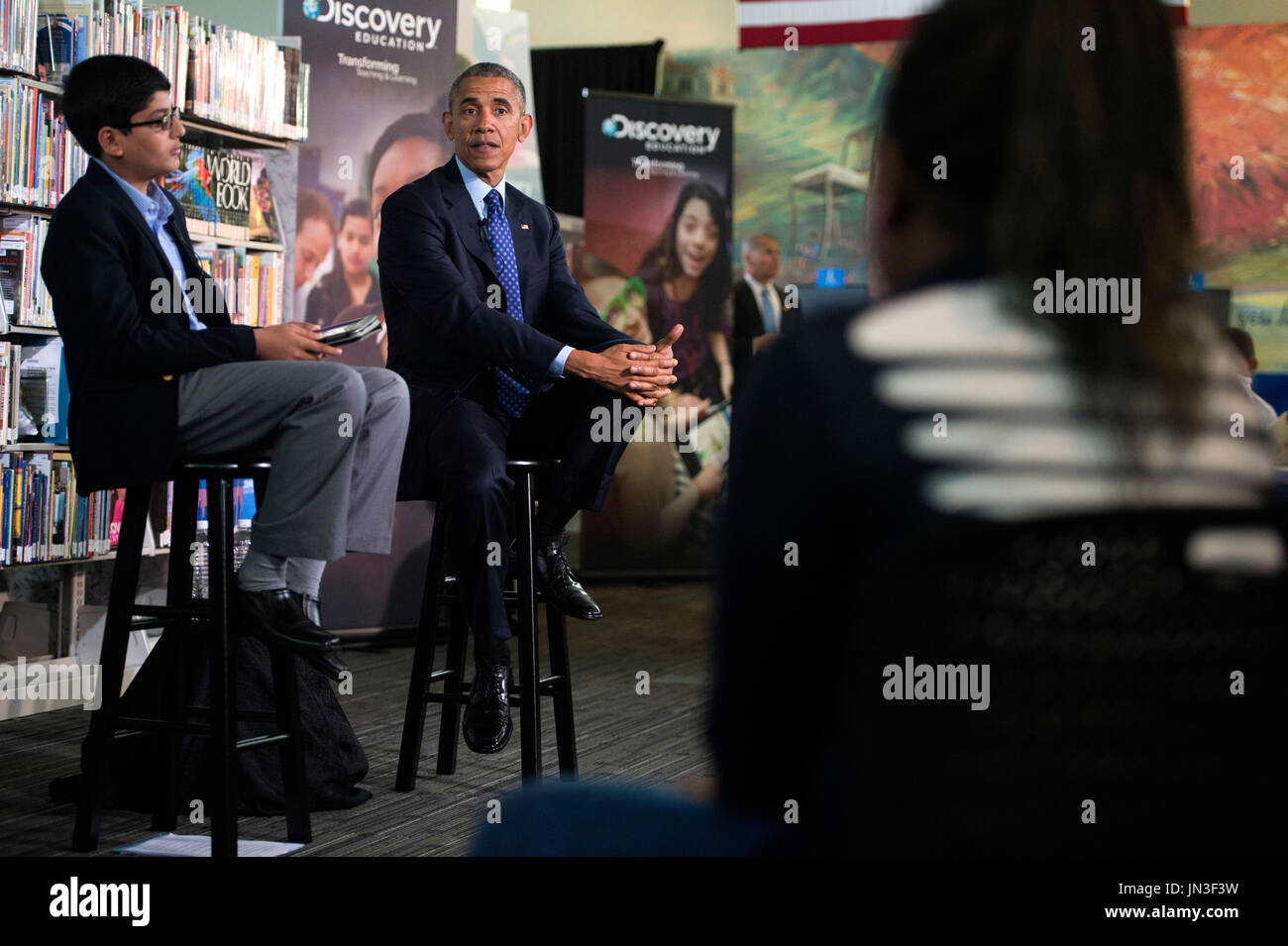 US President Barack Obama (R), with student moderator Osman Yaya (L ...