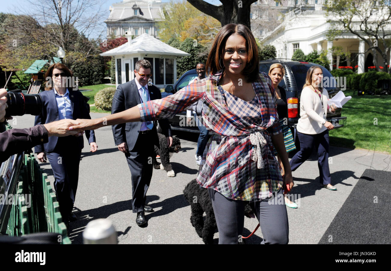 United States first lady Michelle Obama shakes hands with guests during ...