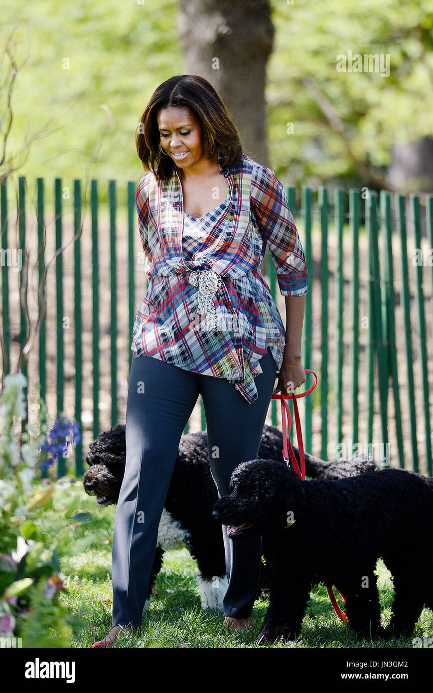 United States first lady Michelle Obama with her dogs, Bo and Sunny ...