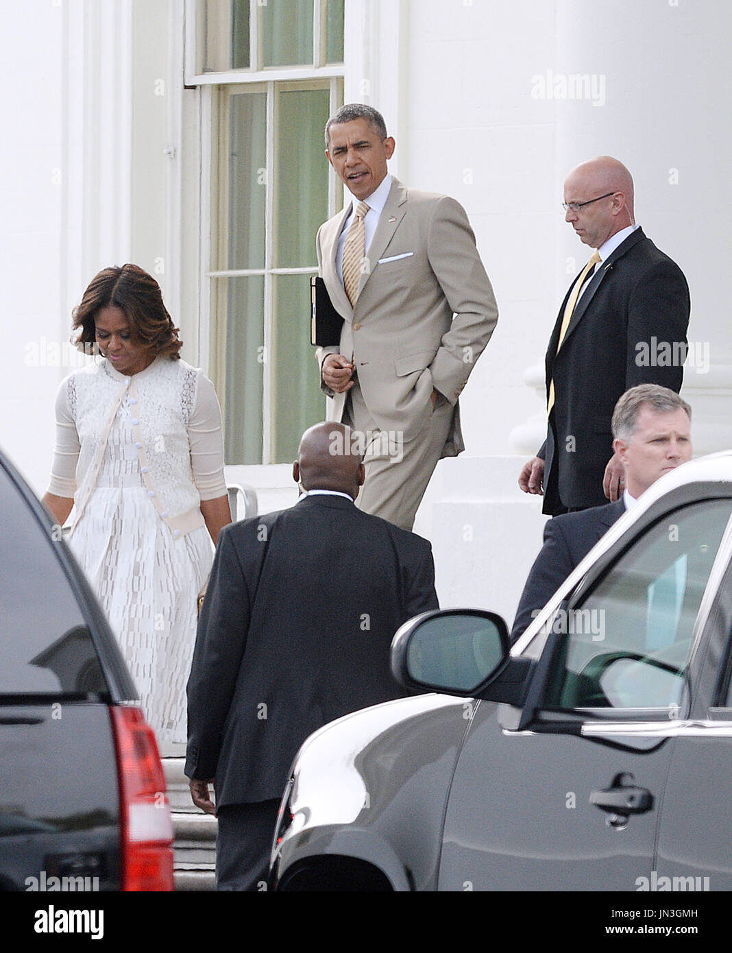 United States President Barack Obama leaves the White House with his ...