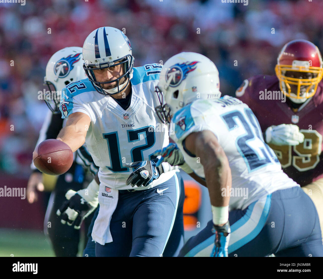 Tennessee Titans quarterback Charlie Whitehurst (12) hands off to ...